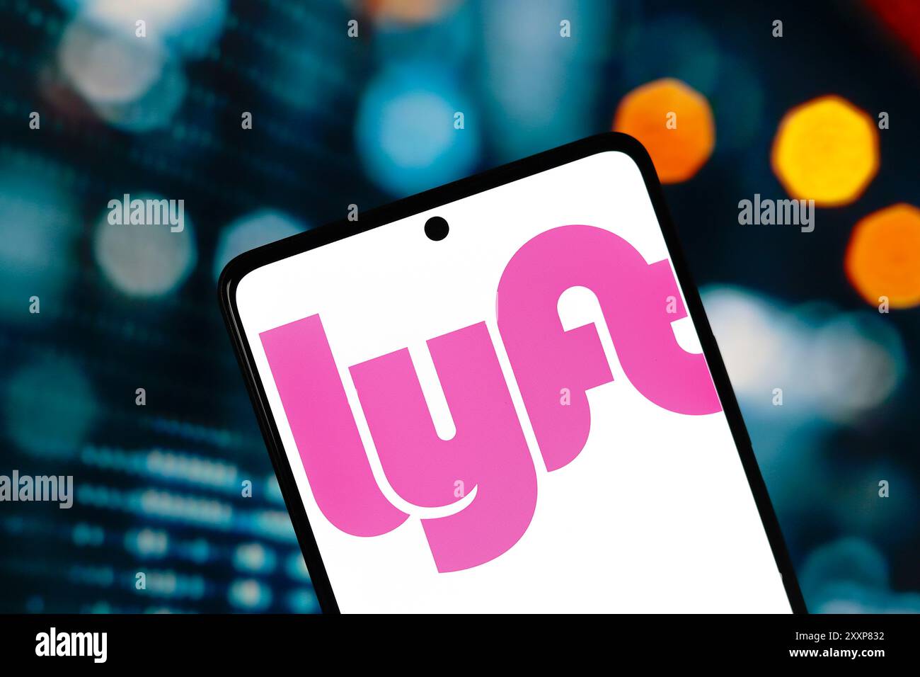 In this photo illustration, the Lyft, Inc. logo is displayed on a ...