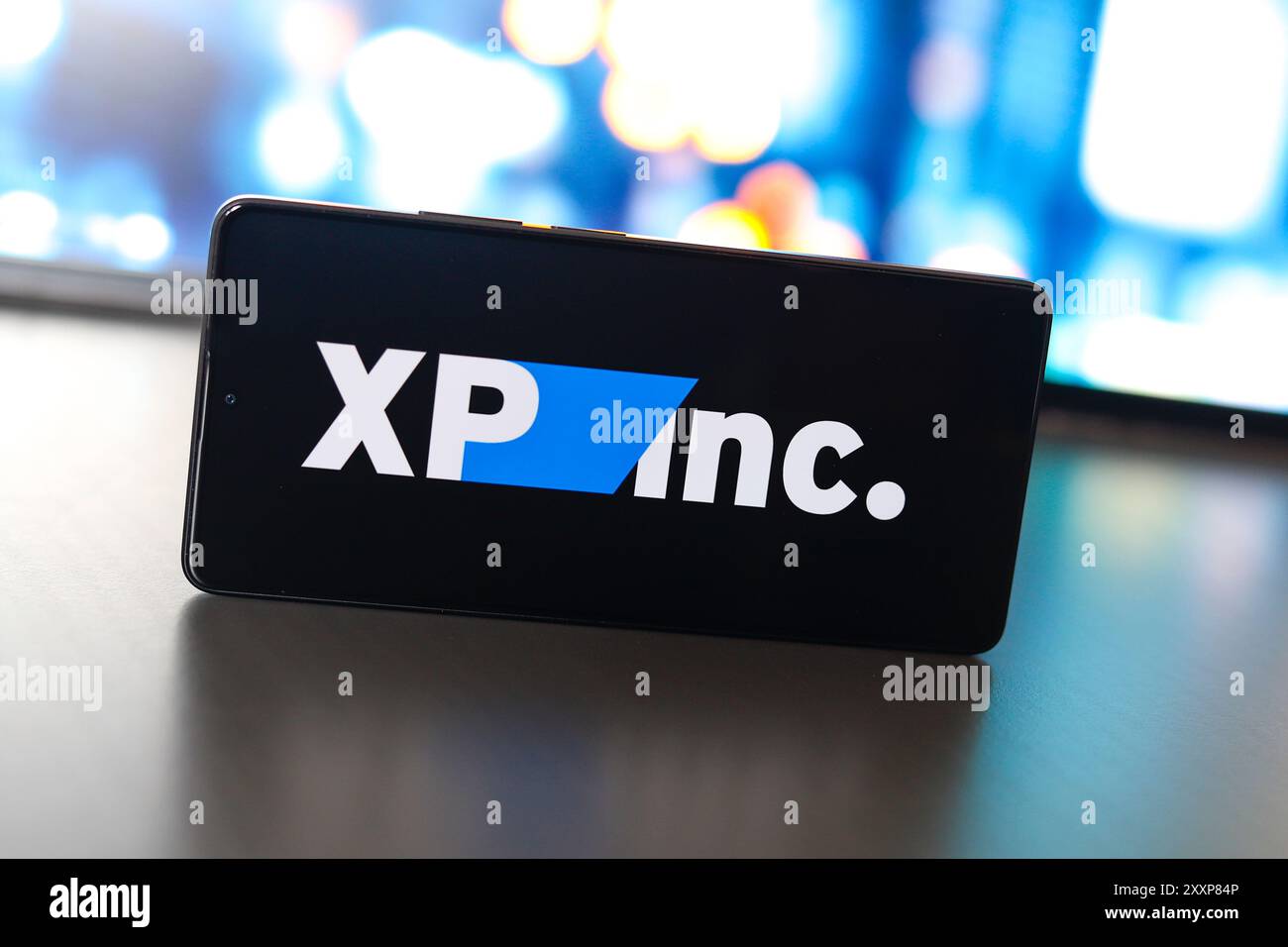 In this photo illustration, the XP Inc. logo is displayed on a ...