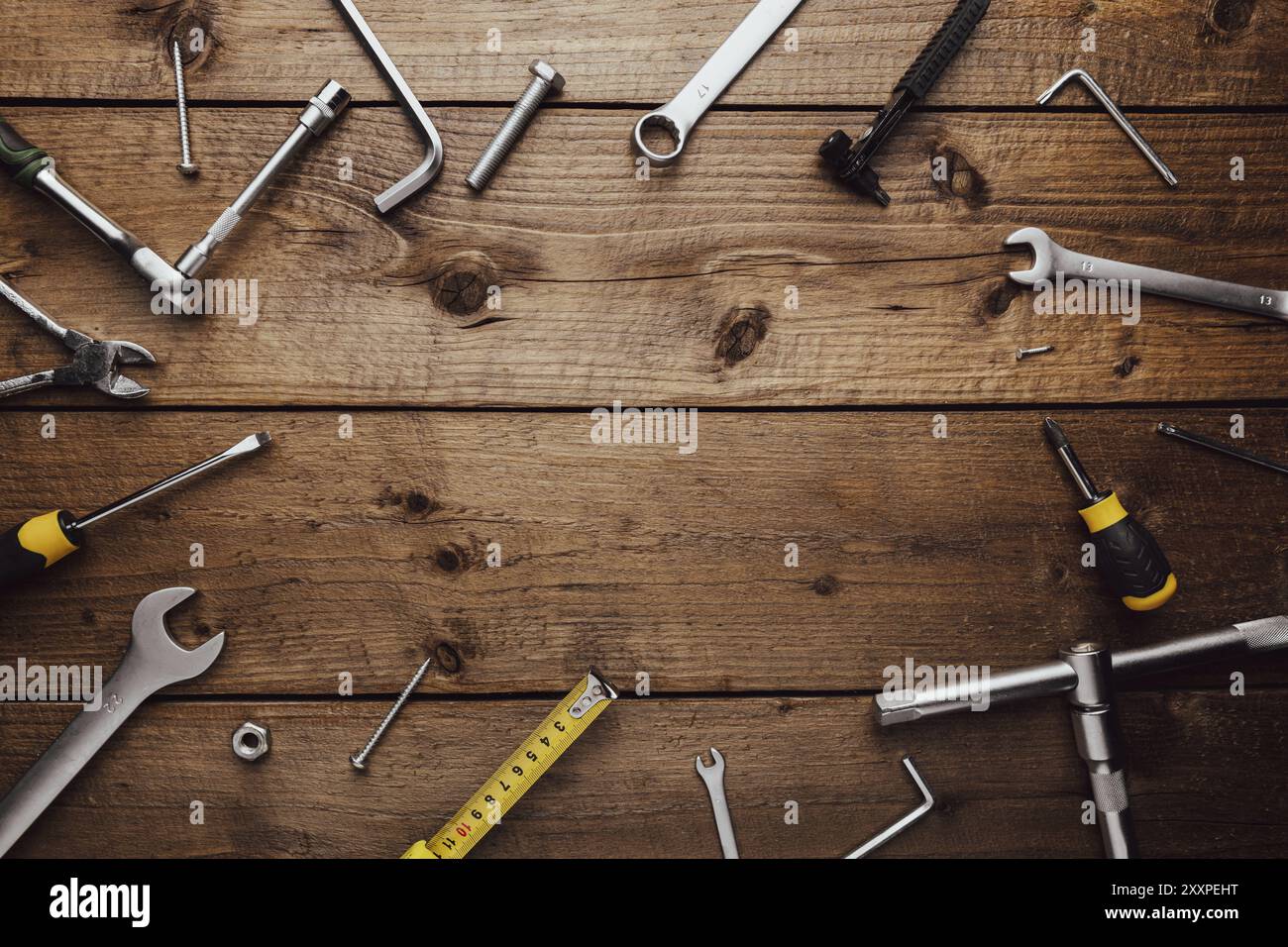 Flat lay with various work tools on wooden background working table ...