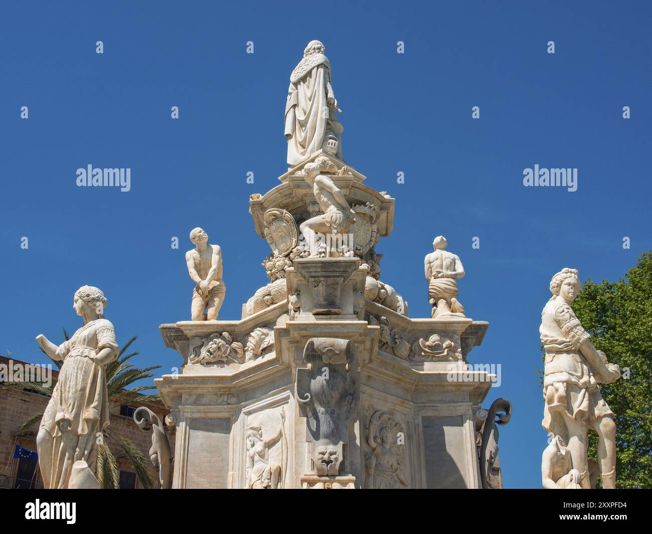 Detailed view of a historic fountain with several statues under a clear ...