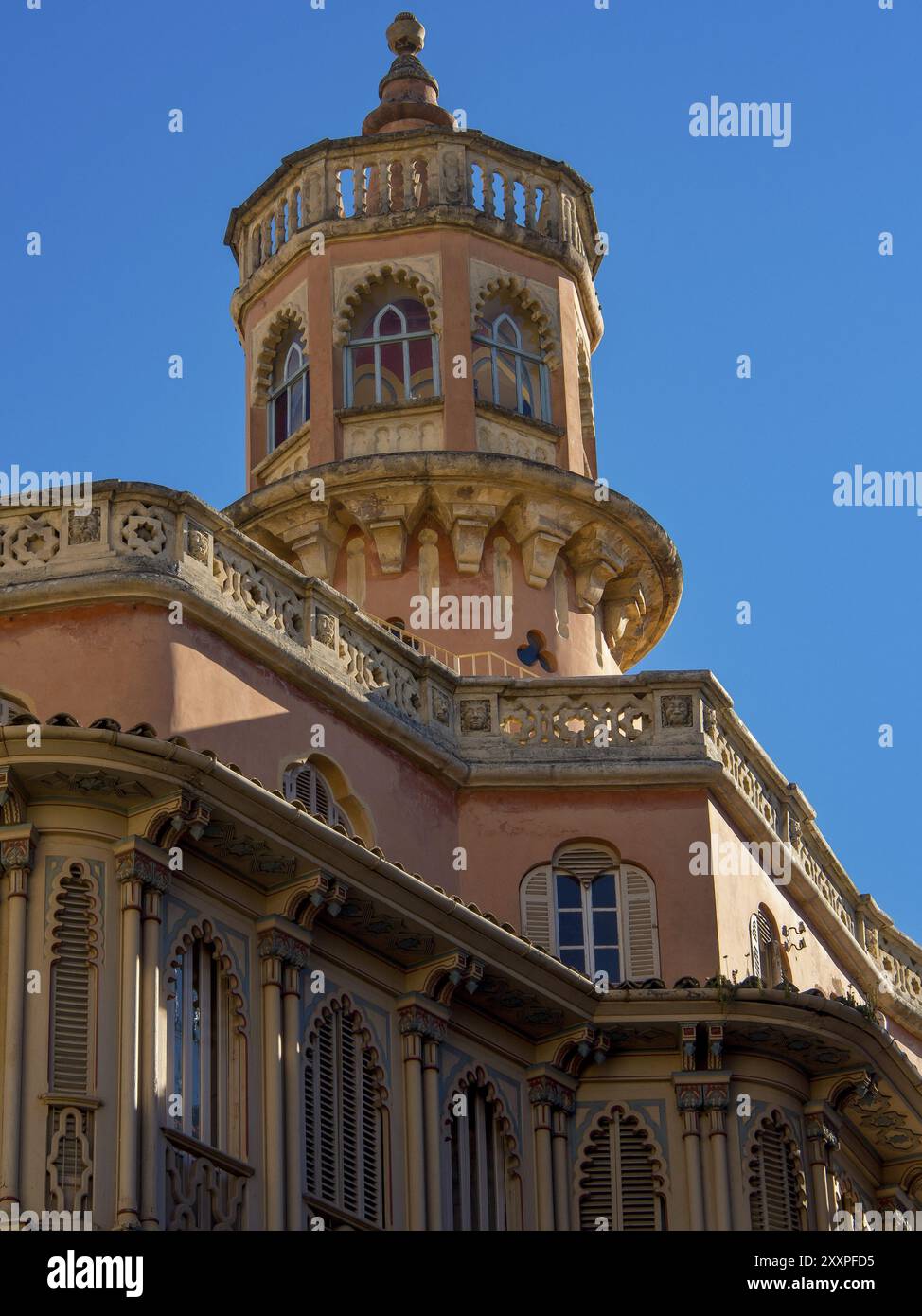 Ornate historic building with a tower and numerous windows under a ...
