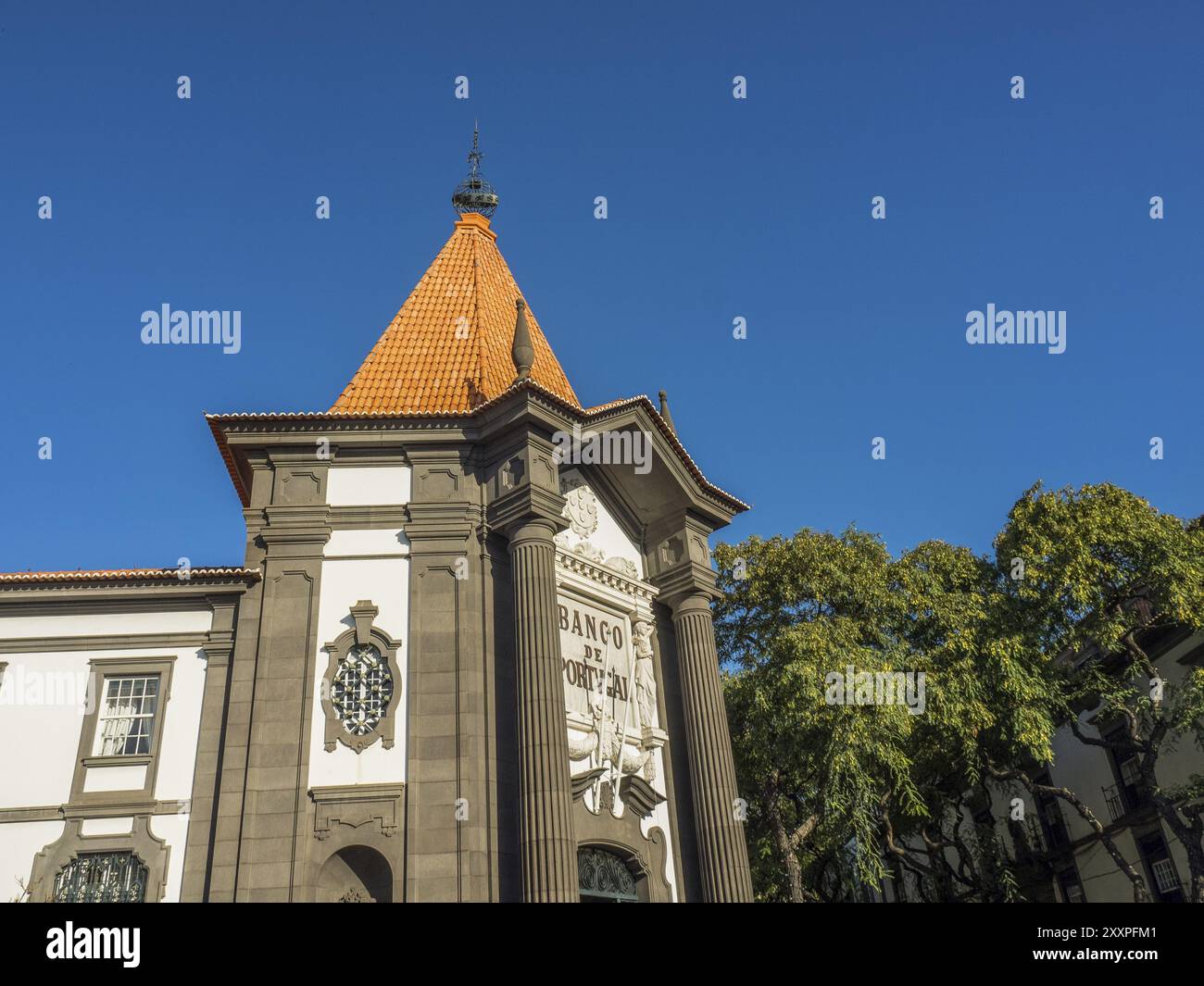 Impressive Banco de Portugal building with pointed red roof under a ...