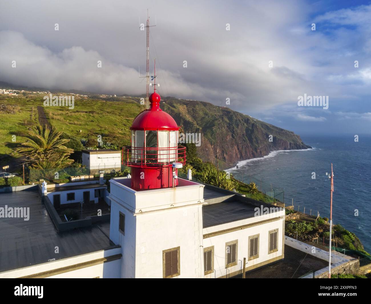 Aerial photo with drone of Ponta do Pargo Lighthouse with mountains on ...