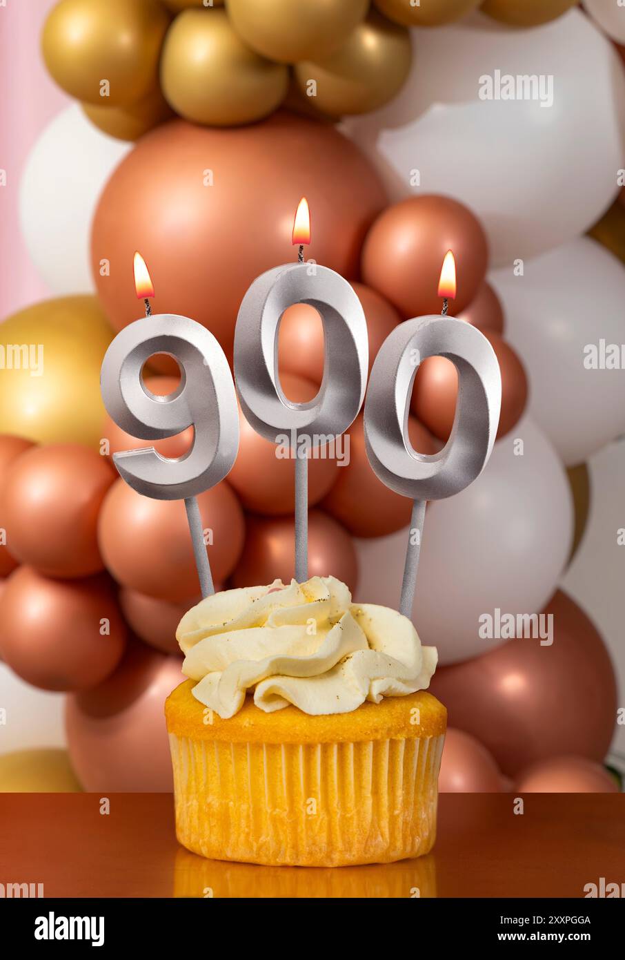 Cupcake with birthday candle on balloons background - Number 900 Stock ...