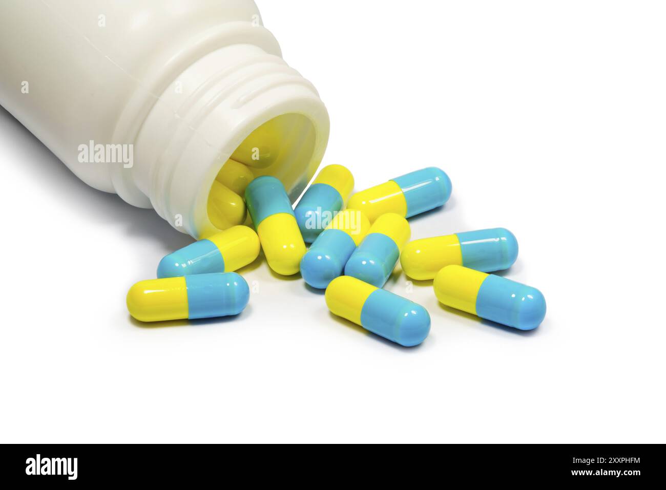 Capsule of antibiotic and plastic container on white background Stock ...