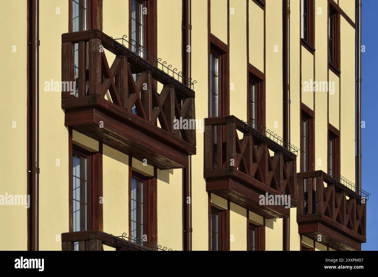 Beautiful wooden french balconies on the wall of the new House Stock ...