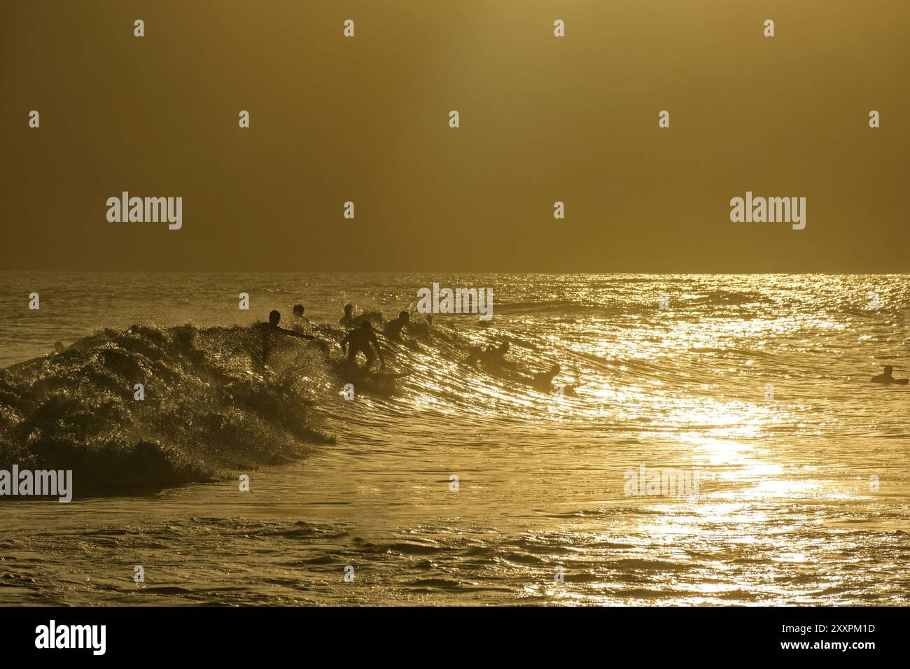 Surfing during the summer sunset at Ipanema beach in Rio de Janeiro ...