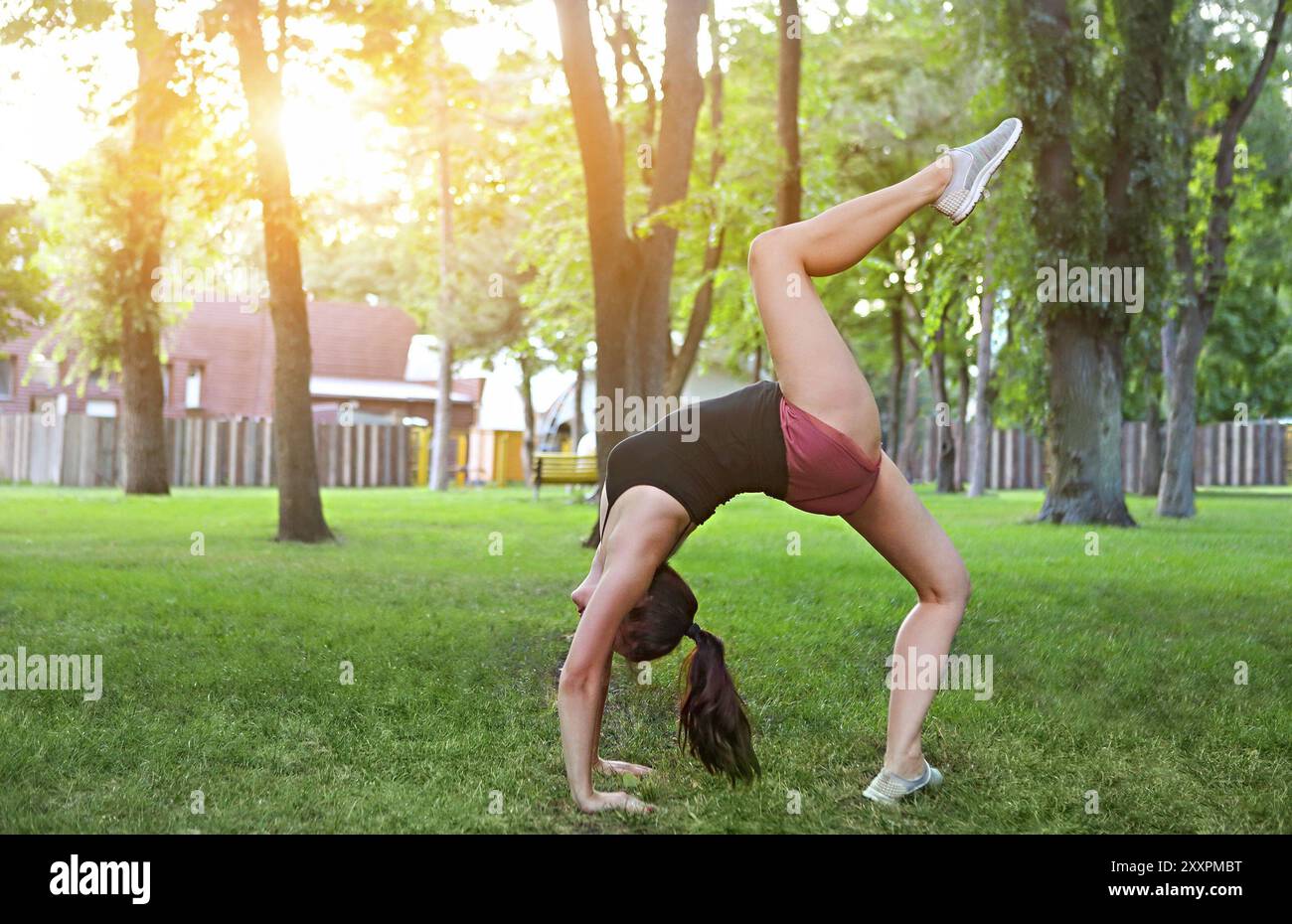 Stretching woman in outdoor exercise smiling happy doing stretches ...