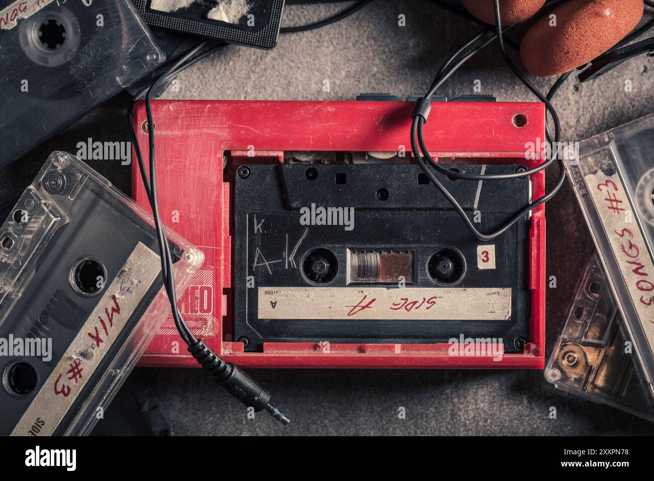 Retro audio cassette with red portable player and headphones Stock ...