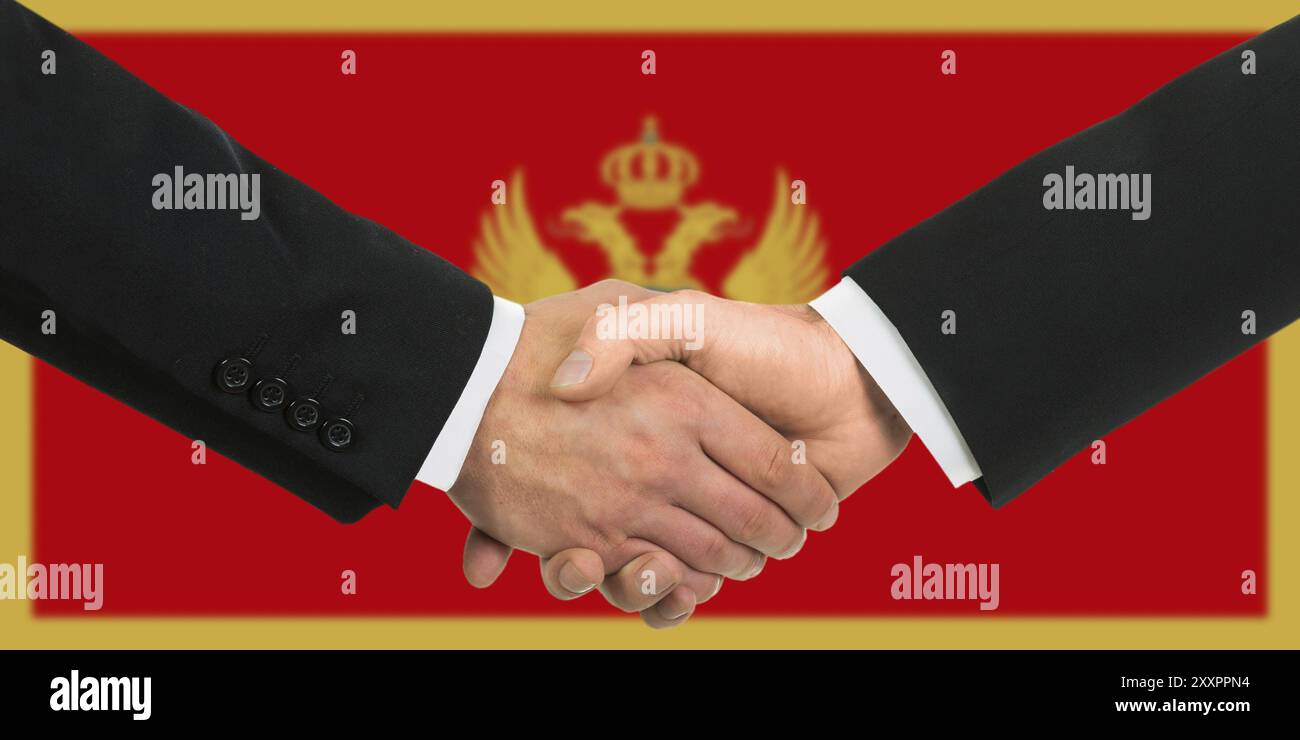 The Montenegro flag and business handshake Stock Photo - Alamy