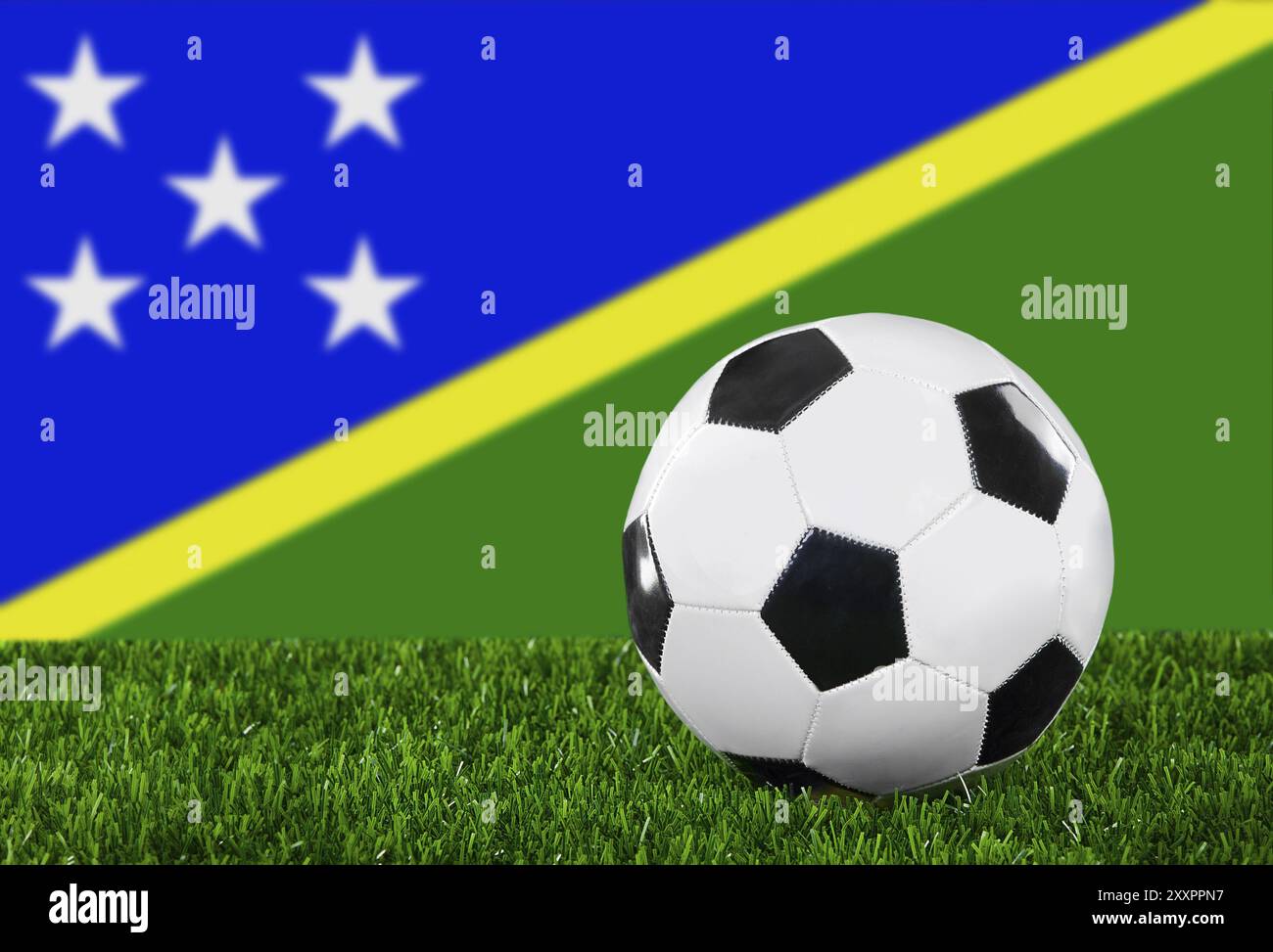 The Solomon Islands flag and soccer ball on the green grass Stock Photo ...