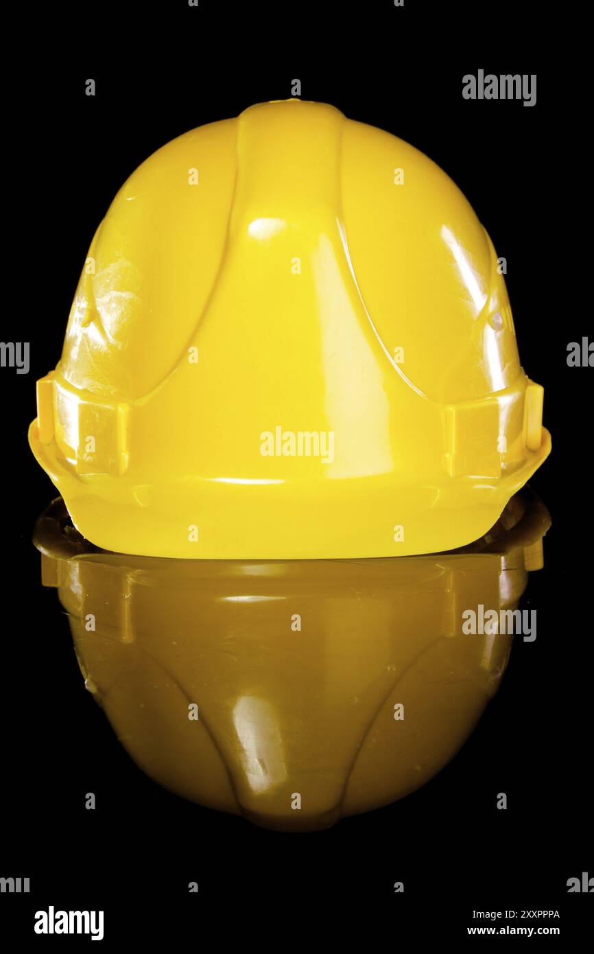Hard hat isolated on a black background Stock Photo - Alamy