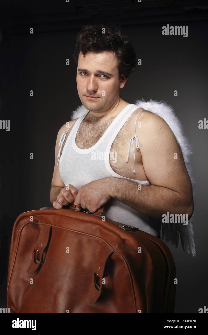 Mr. Angel with brown bag. Creepy character portrait Stock Photo - Alamy