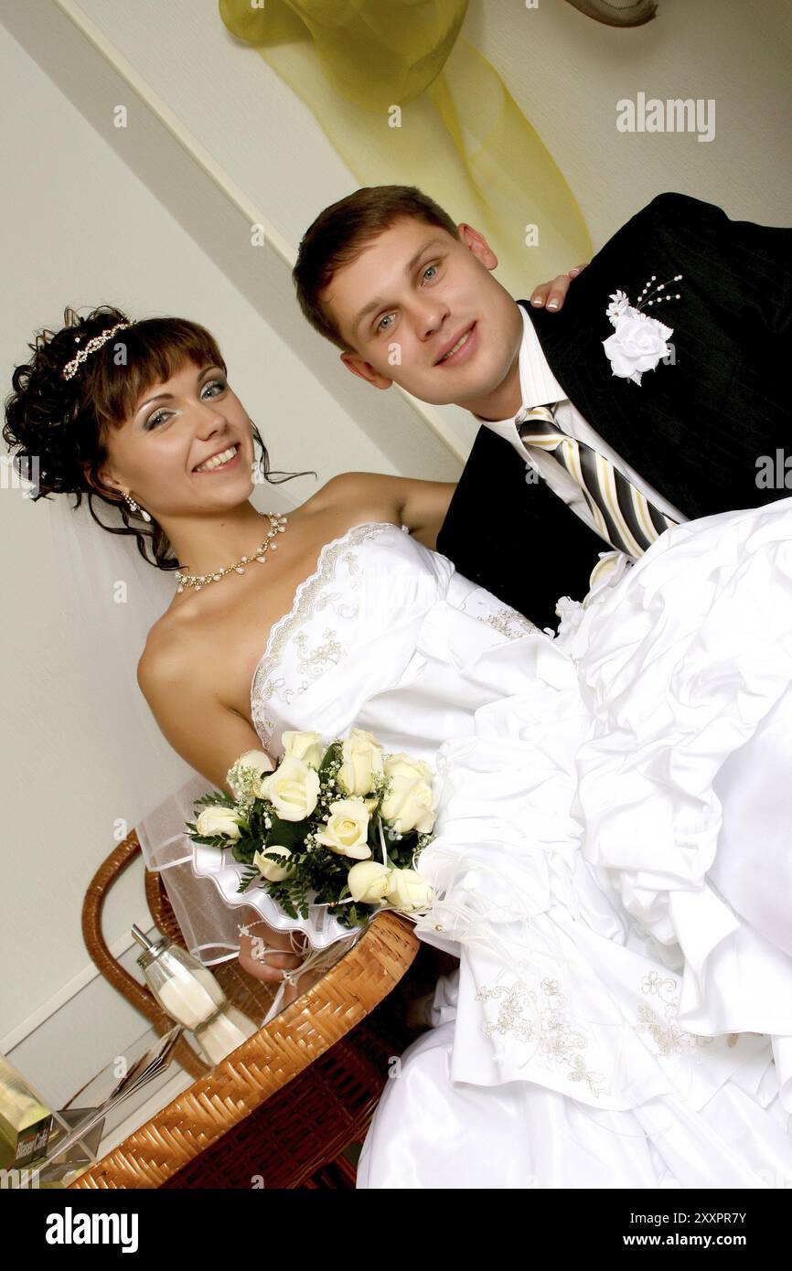 Newly married together in a photo pose Stock Photo - Alamy