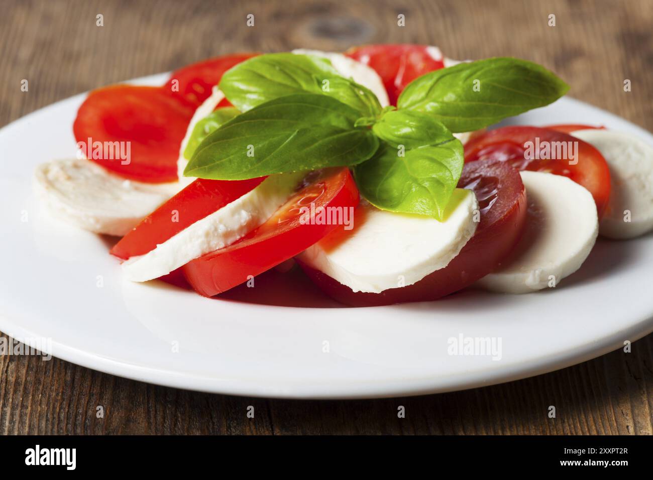 Italian insalada caprese on a plate Stock Photo - Alamy