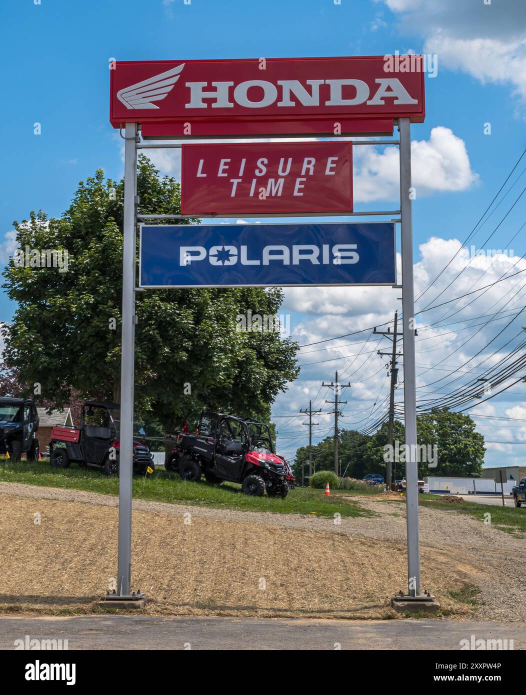 SIgns on the side of the road for a Honda and Polaris dealership in ...