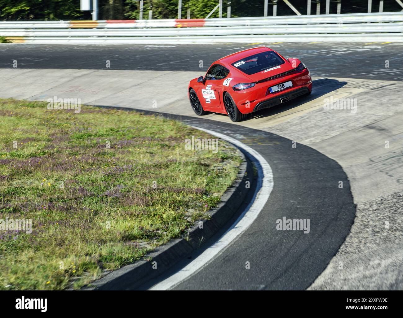 View from the perspective of a racing driver on a red sports car ...
