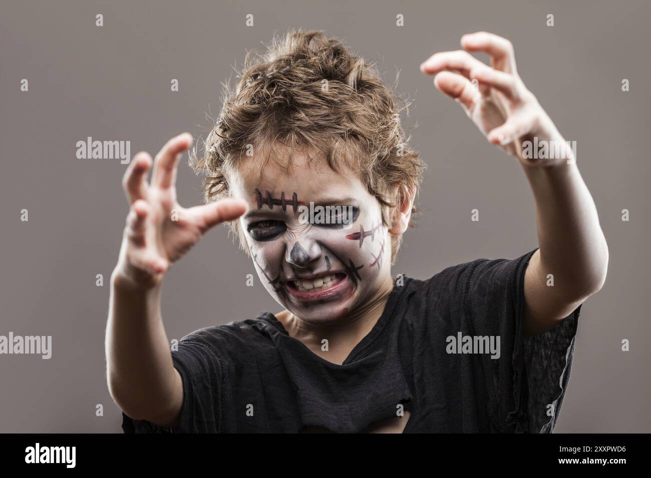 Halloween or horror concept, screaming walking dead zombie child boy ...