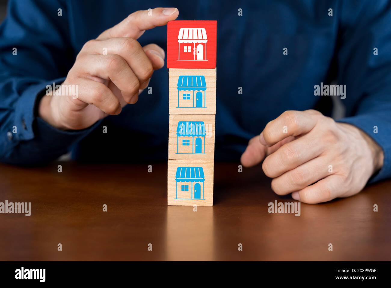 Franchise business concept. Businessman touching wooden blocks with ...