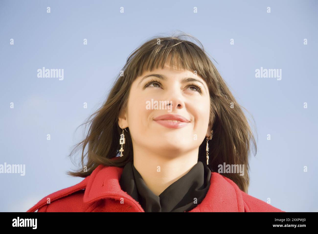 Pretty Girl Portrait On The Sky Background Stock Photo - Alamy