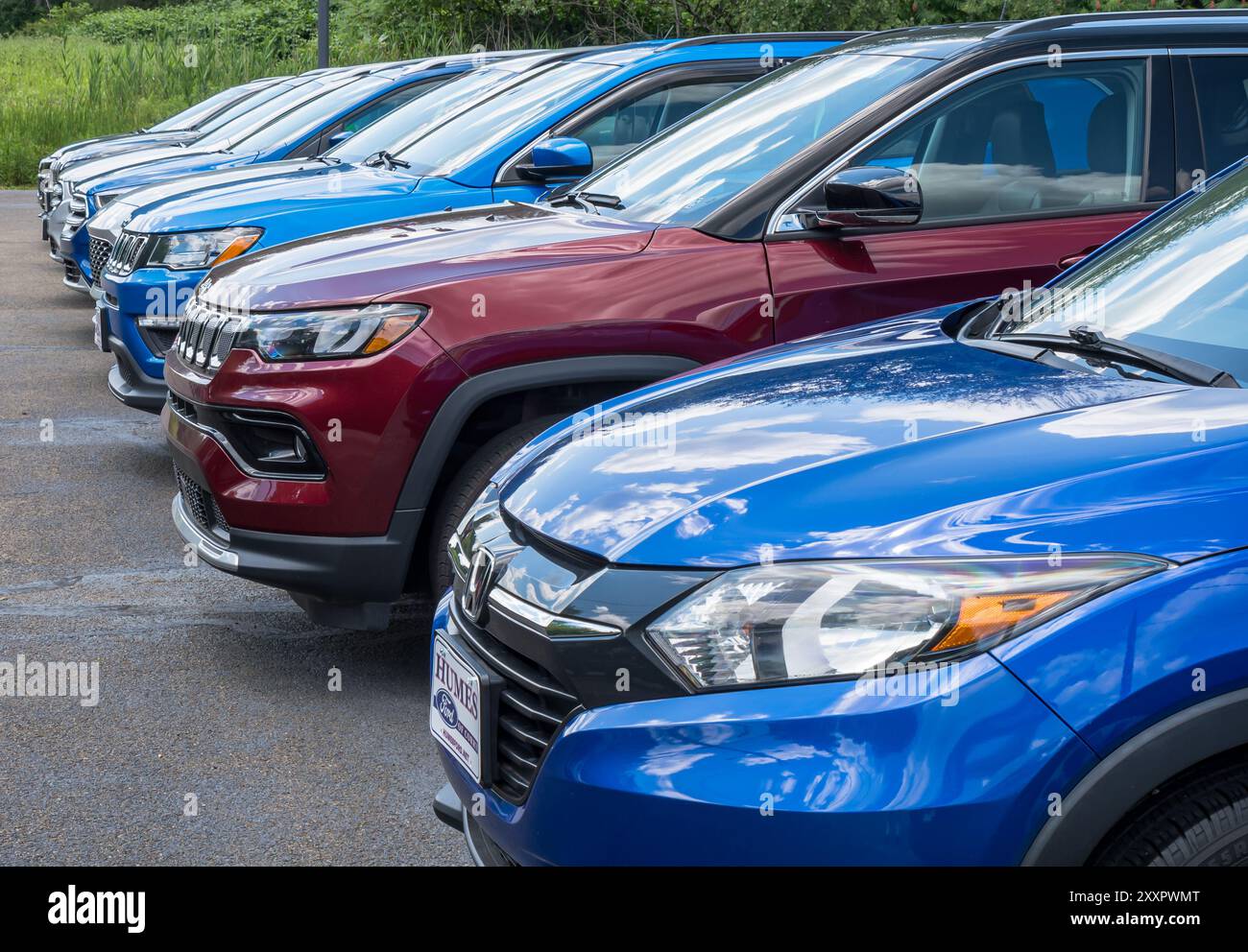 A line of Ford vehicles for sale at a dealership in Corry, Pennsylvania ...