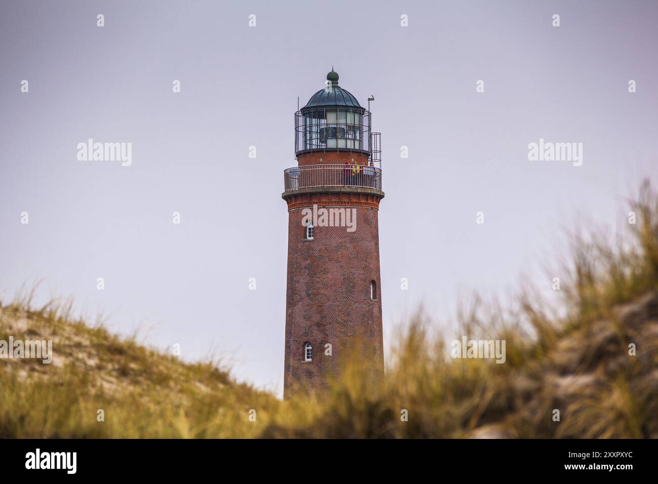 Red lighthouse in cloudy weather Stock Photo - Alamy