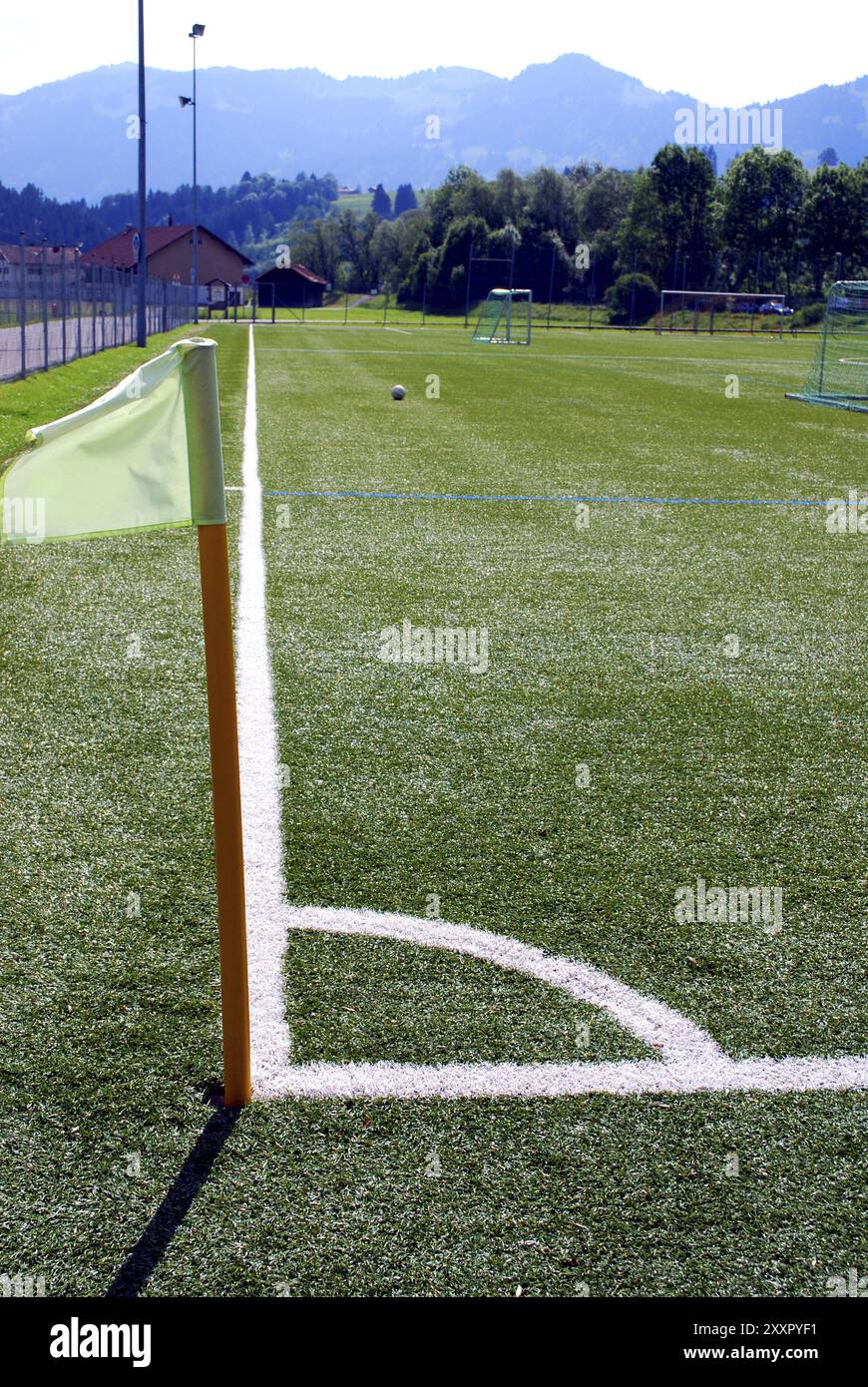 Corner flag on football field in front of mountains Stock Photo - Alamy