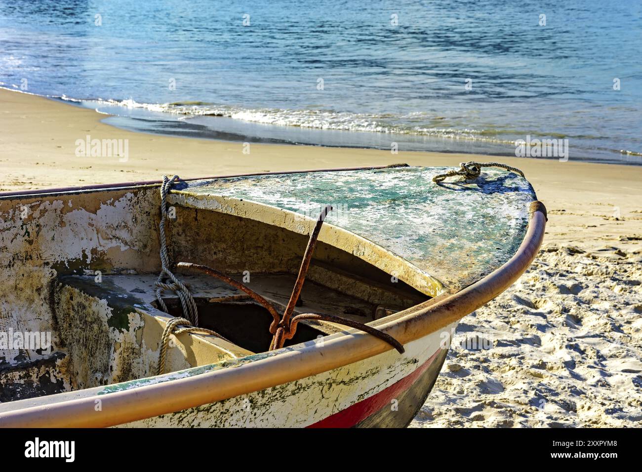 Old fishing boat on the sand of Copacabana beach in Rio de Janeiro ...