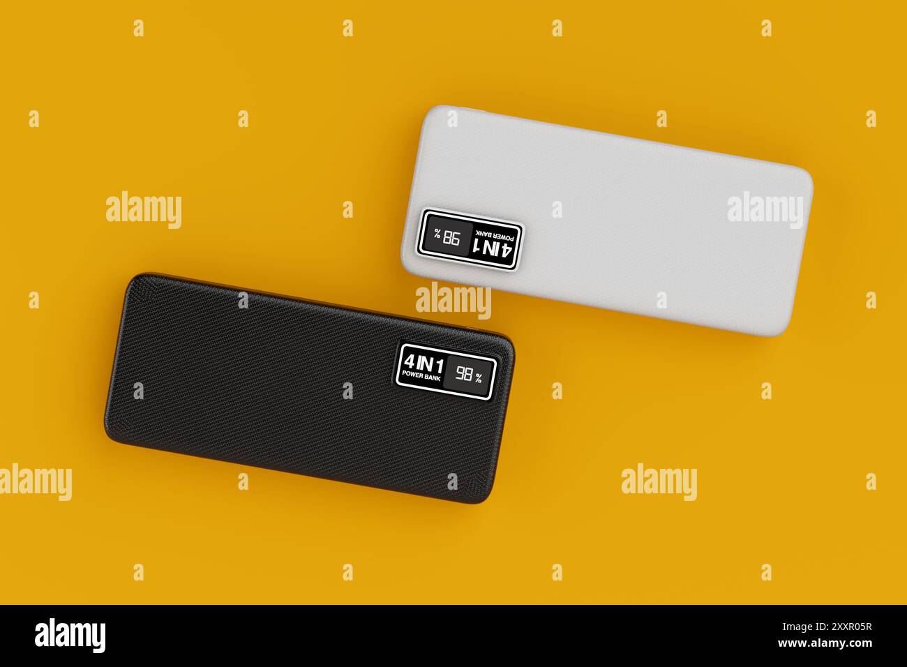 White and Black Mobile Devices Charging Power Banks on a yellow ...