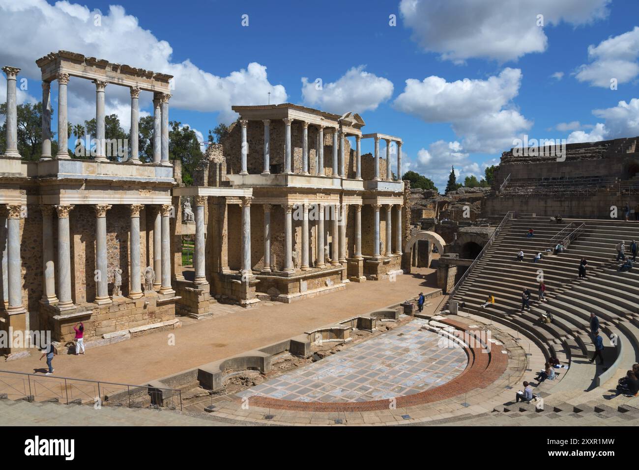 Wide view of a Roman theatre with ancient ruins and spectators on the ...