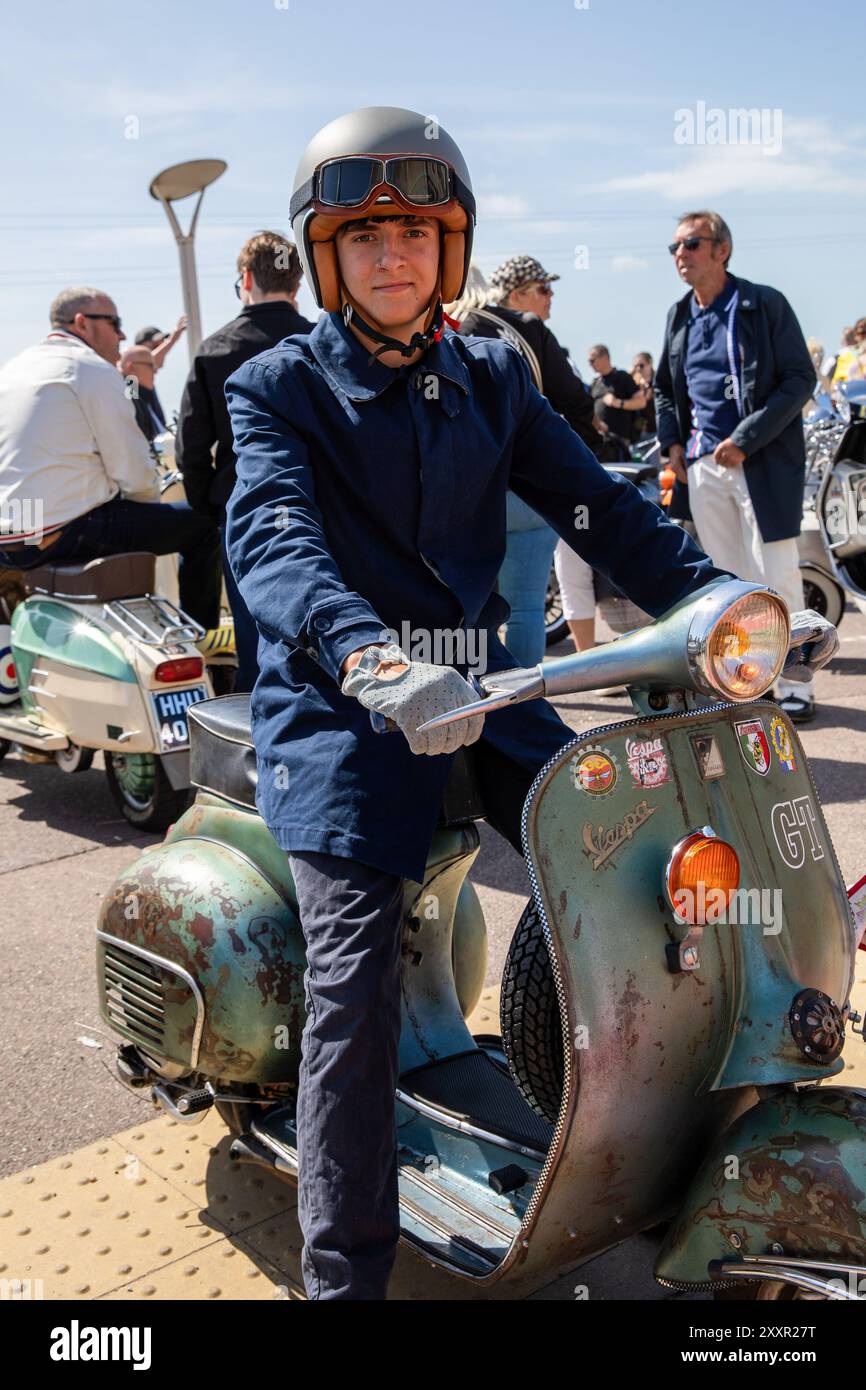 A young Mod sits on a scooter. Thousands attend the annual Mod ...