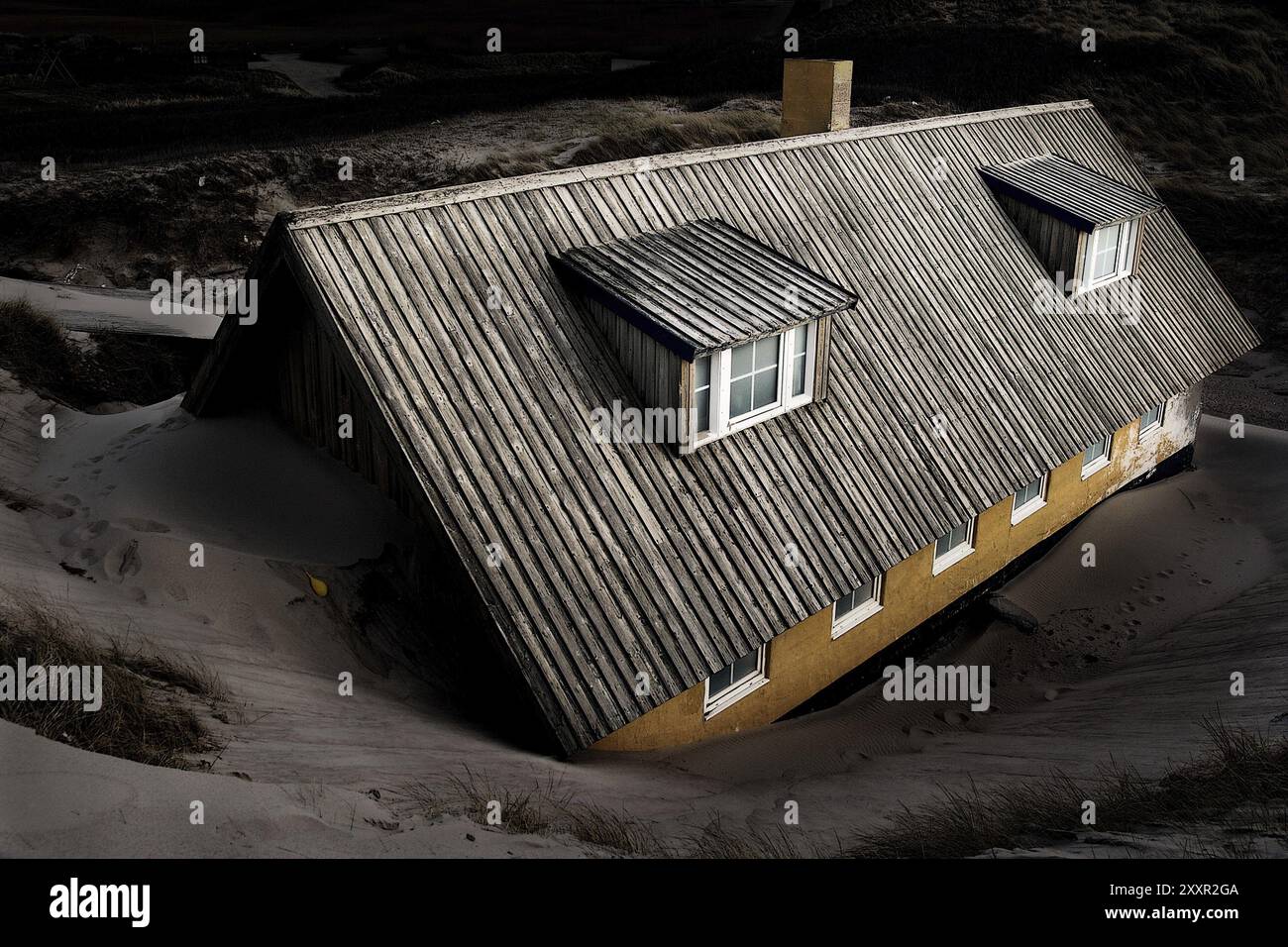 Moving dune endangers residential building caused by a sand dune Stock ...