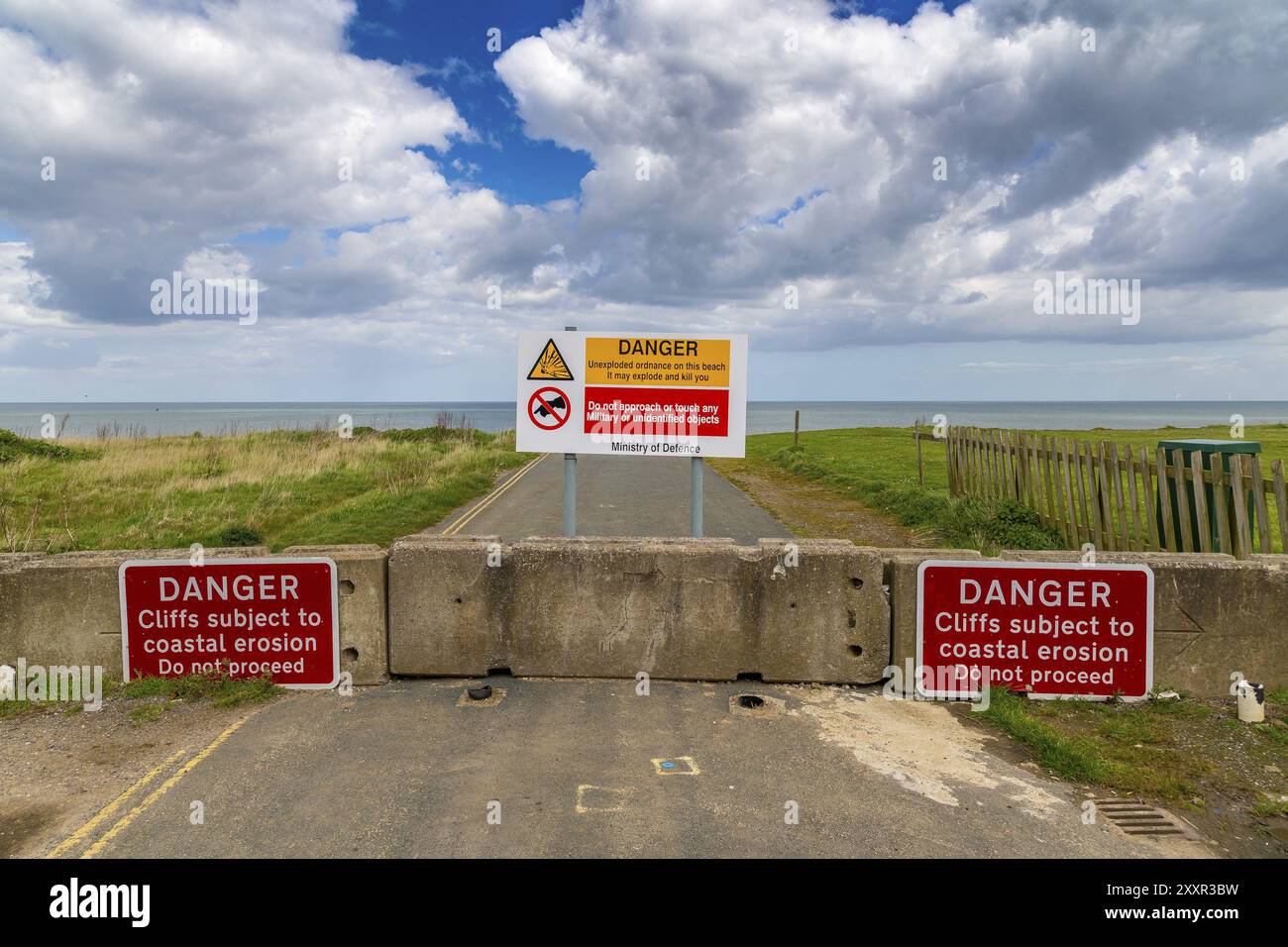 Warning signs on the closed road to the coast, which has been destroyed ...
