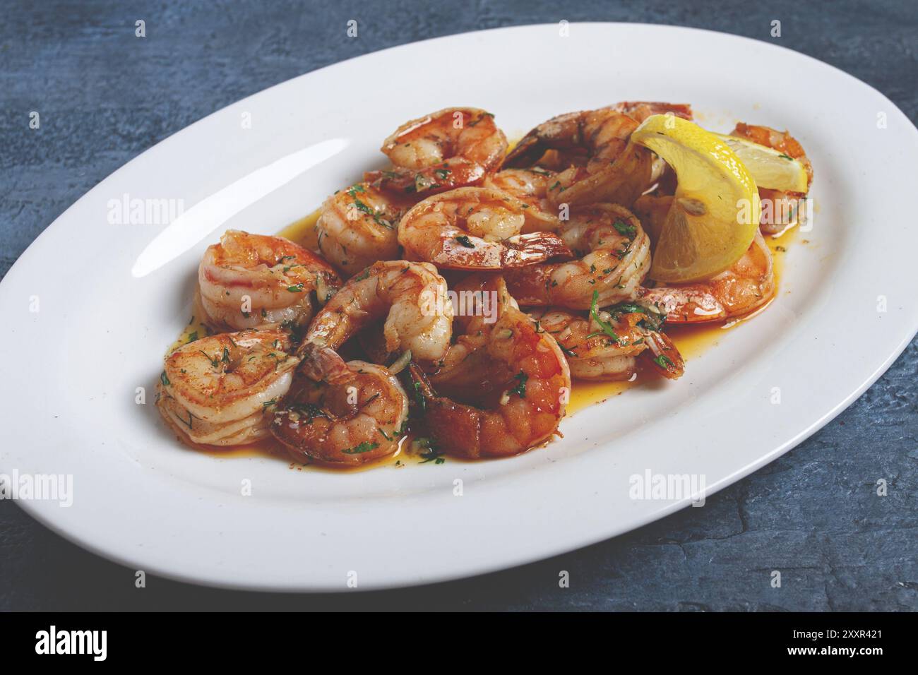 Fried tiger prawns, jumbo, in garlic sauce, in butter, with herbs, on a ...