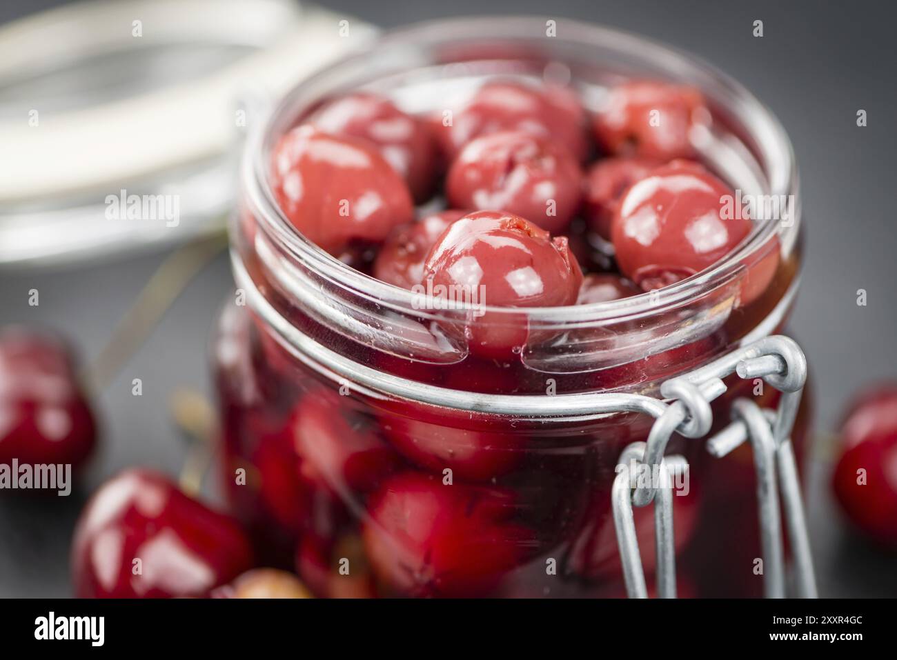 Preserved Cherries on a vintage slate slab as detailed close-up shot ...