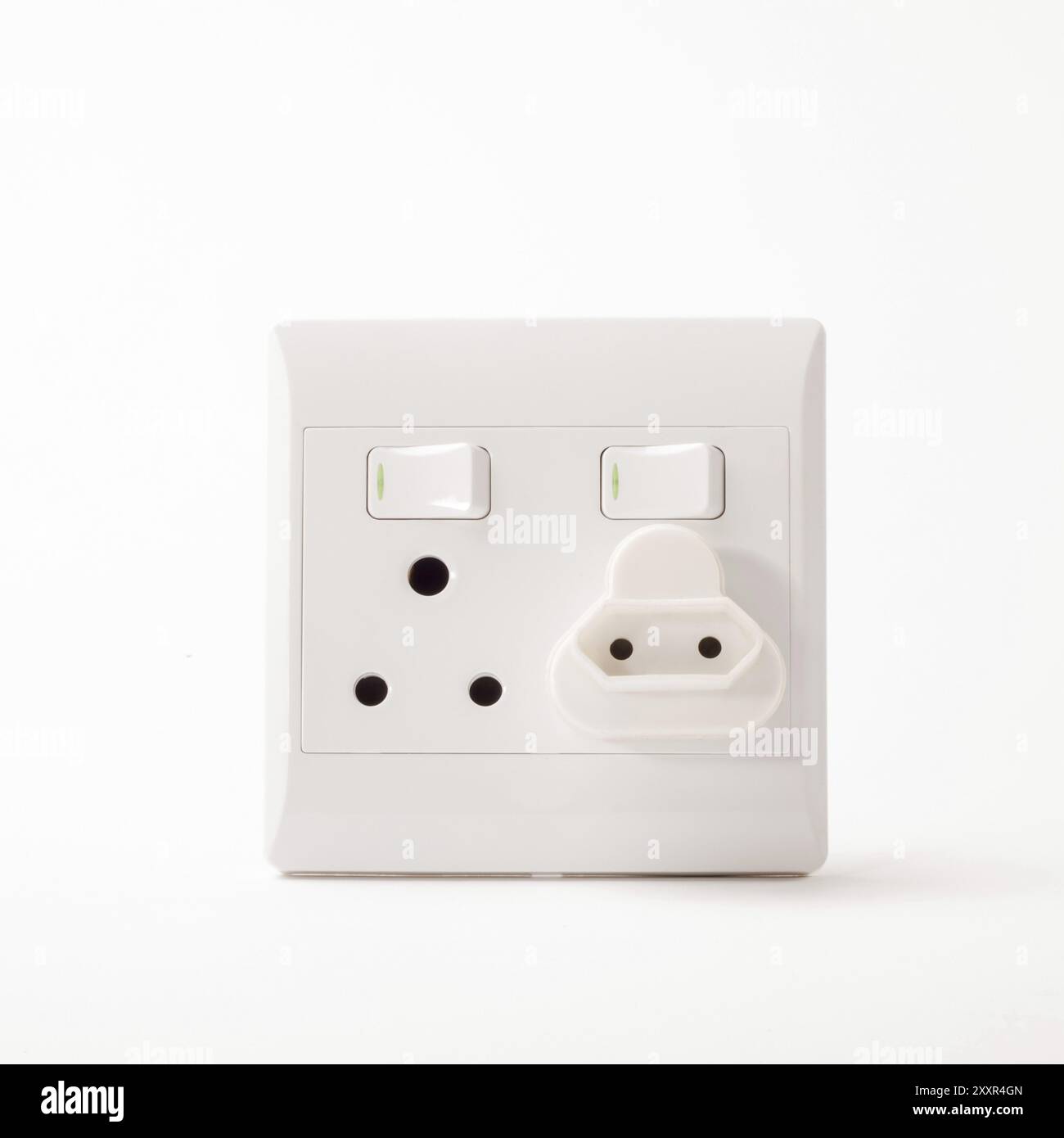 A South African Electric Double Wall Plug with an adapter for a two ...