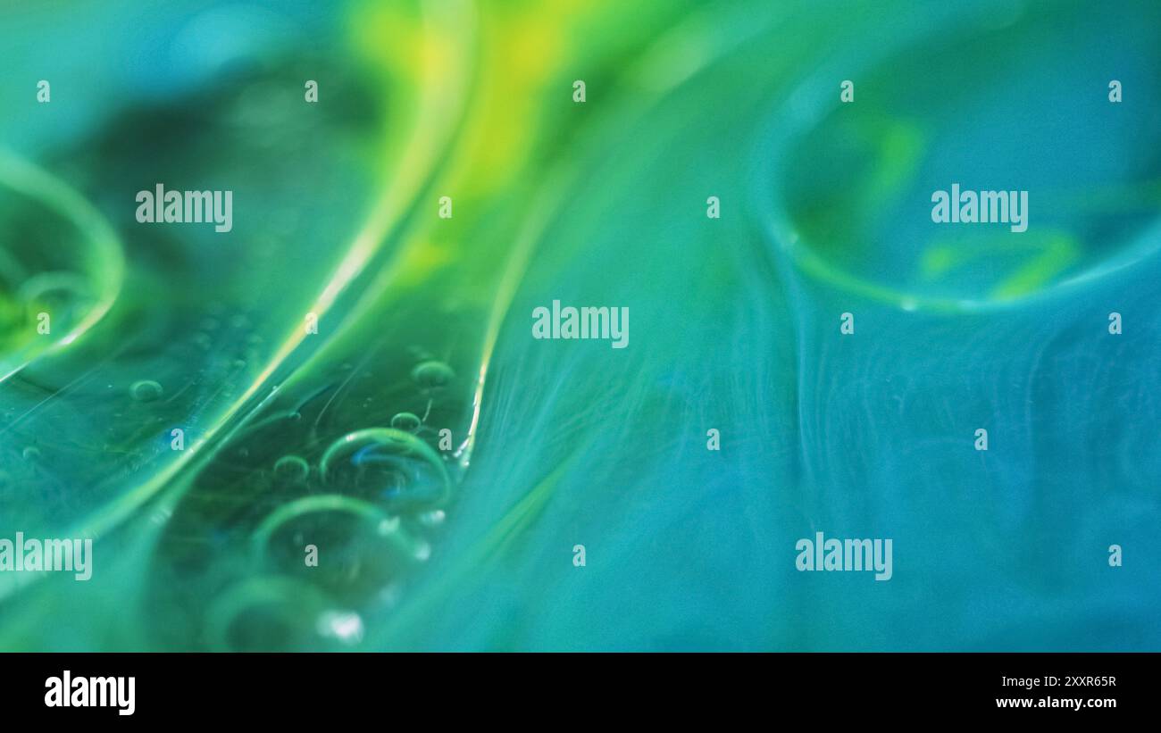 Color mist. Paint water mix. Defocused cyan blue green transparent oil ...