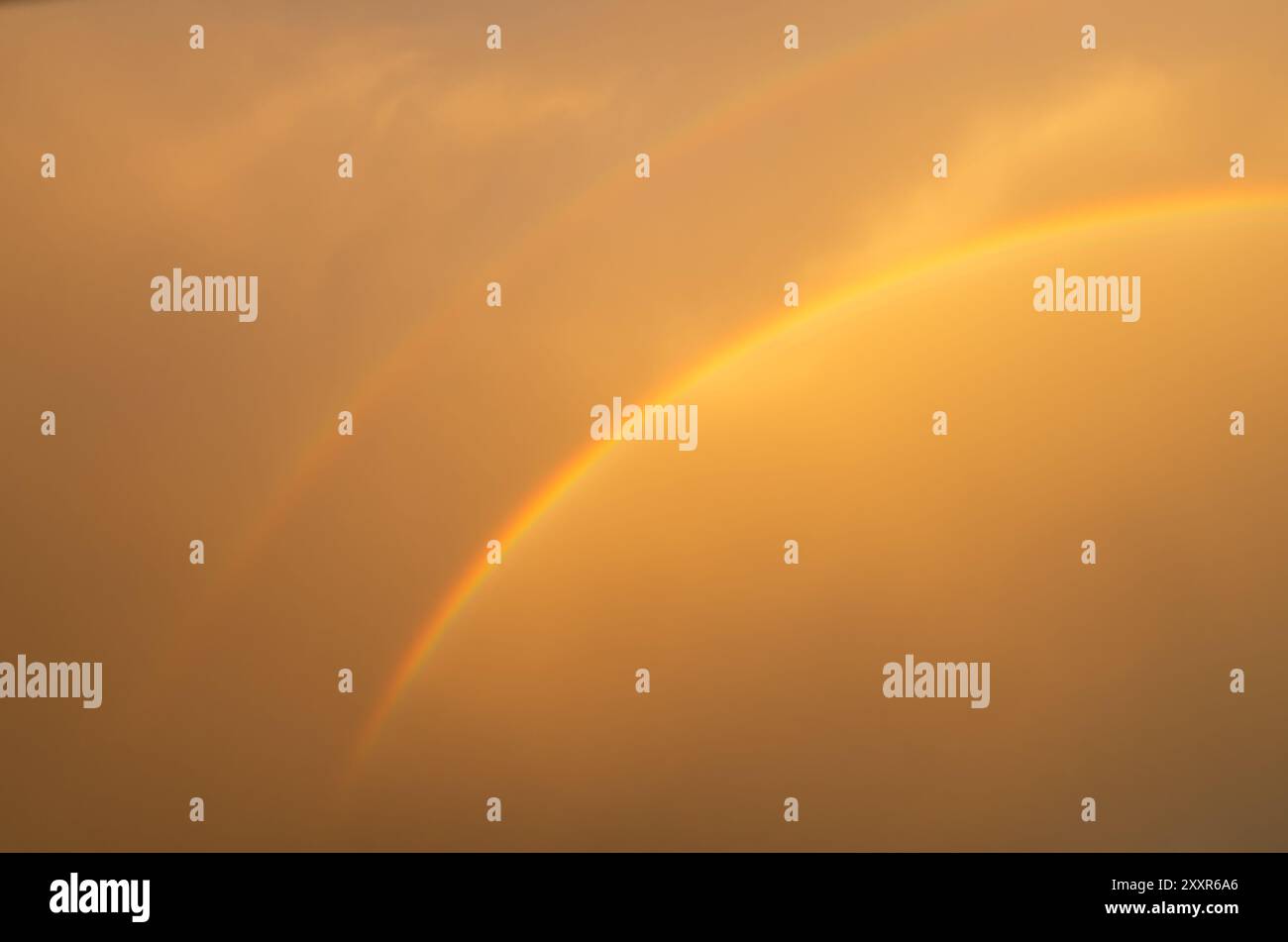 Rainbow At Hazy Sunset Stock Photo - Alamy