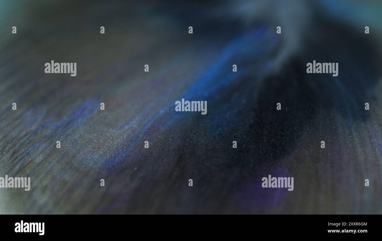 Sparkling ink. Glitter texture. Defocused blue purple gold color paint ...