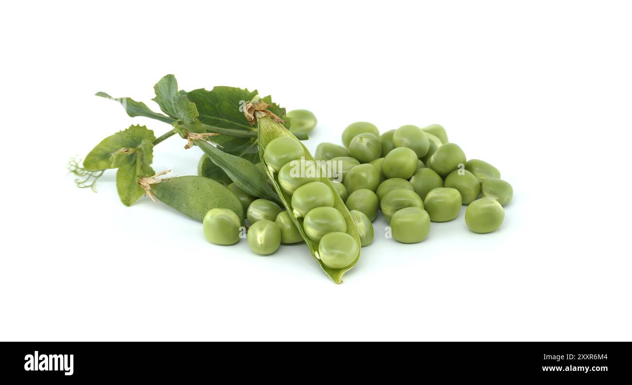 Bunch of green peas on a white background. The peas are in various ...