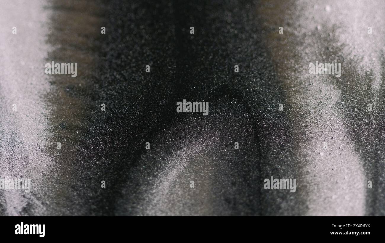 Shimmer ink. Glitter paint. Blur gray black silver color flowing ...