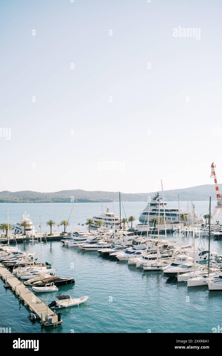 Luxury superyachts stand along the pier near moored motor yachts Stock ...