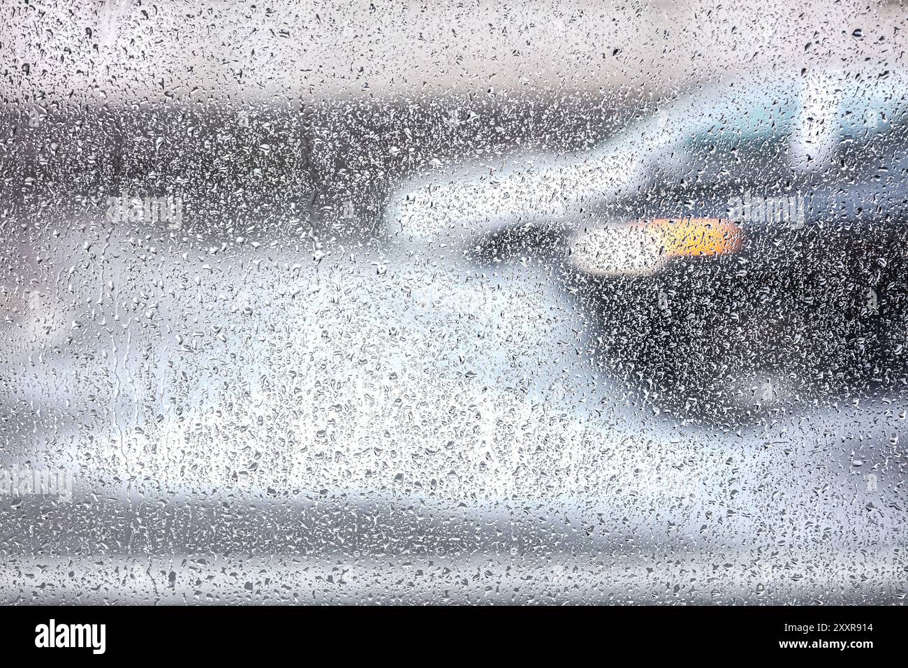 city street with cars through wet window glass with raindrops Stock ...