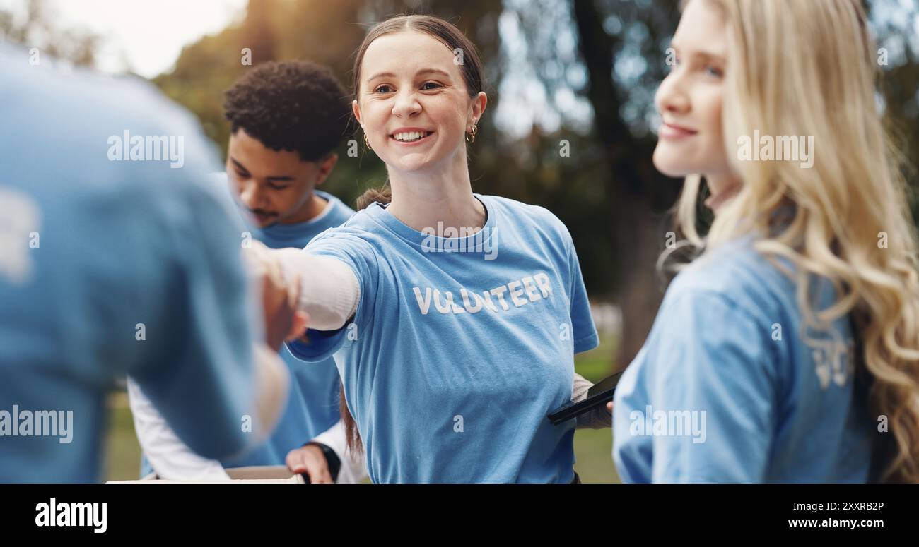 Handshake, volunteer and woman in park with smile, agreement and ...