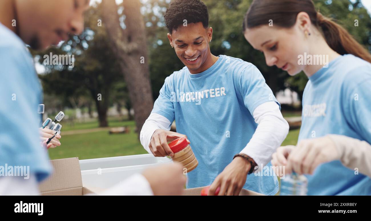 Donation, volunteering and group of people in park together for ...