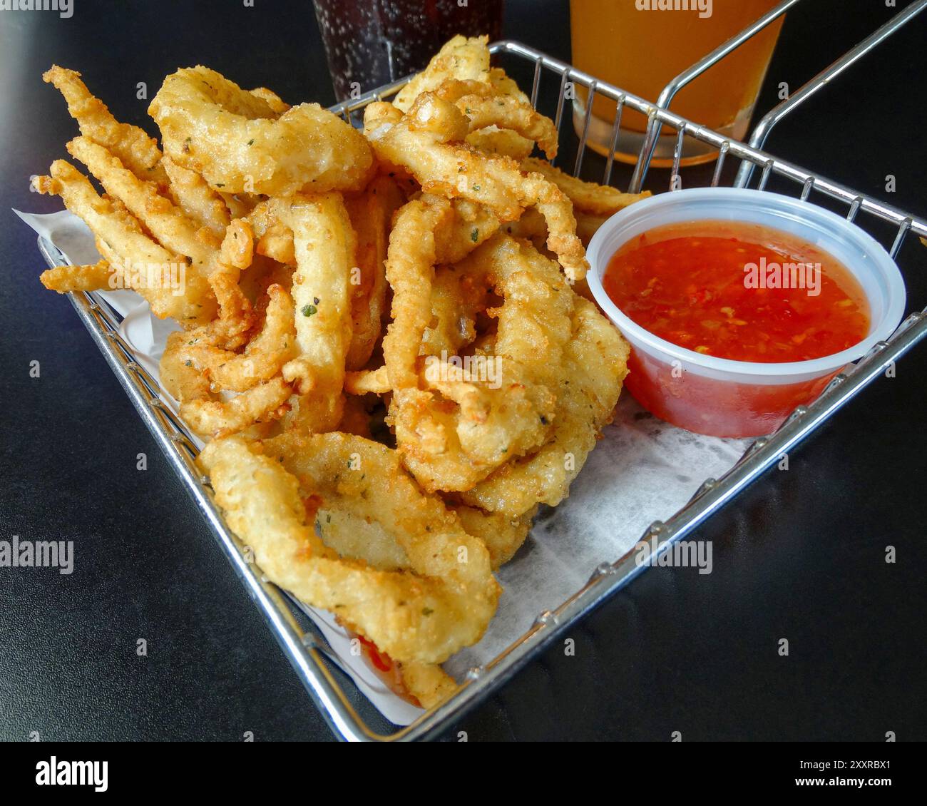 Deep fried calamari at a restaurant Stock Photo - Alamy