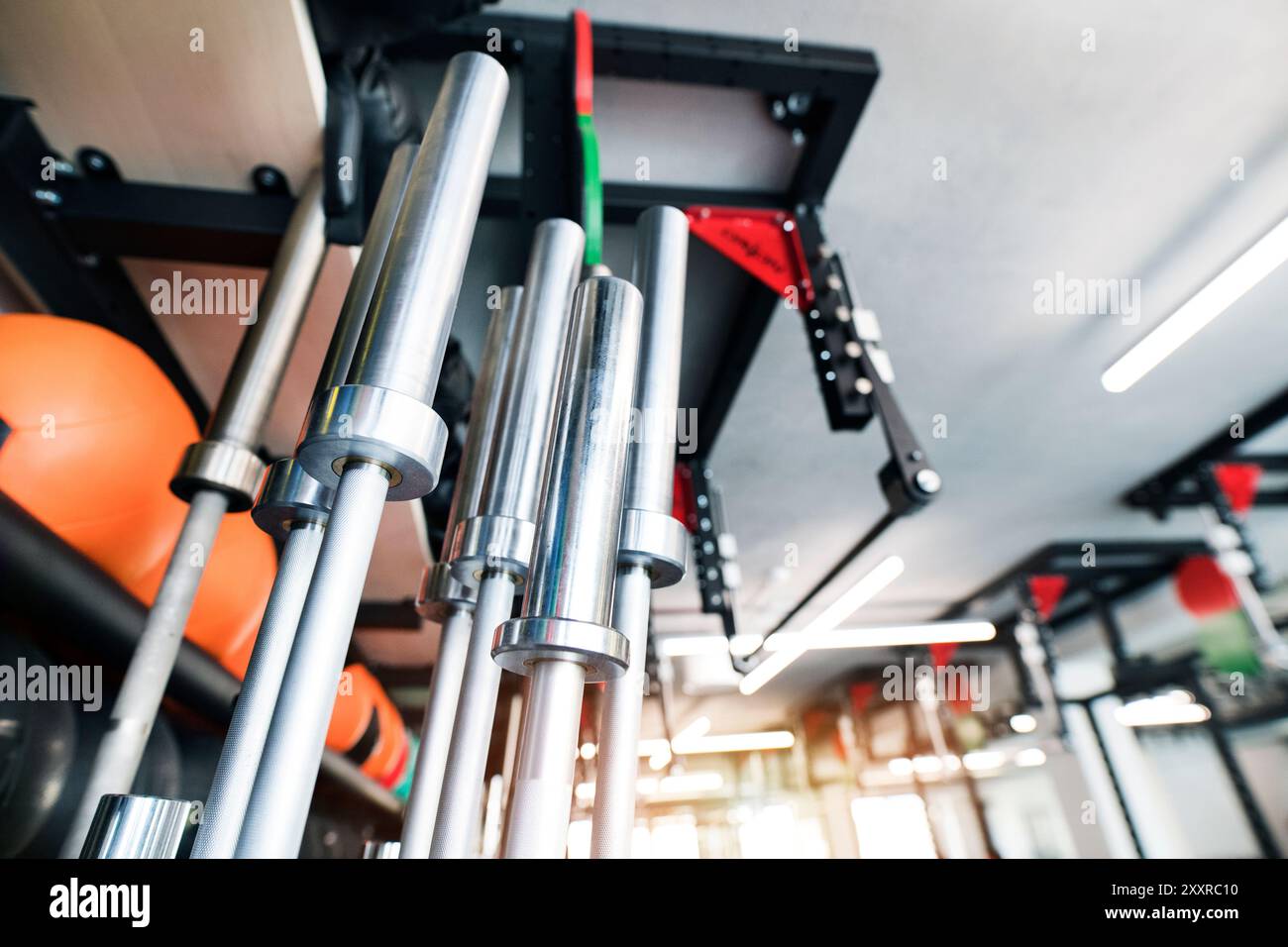 Metal bars, empty barbells in rack for strength training in gym Stock ...