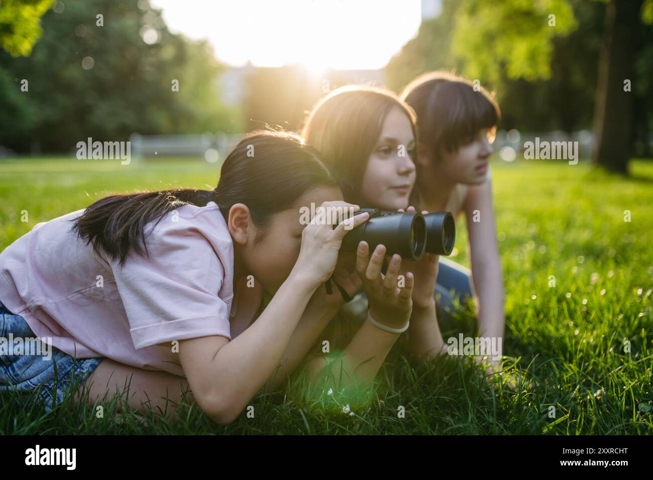 Young girl students learning about nature and wildlife in urban ...