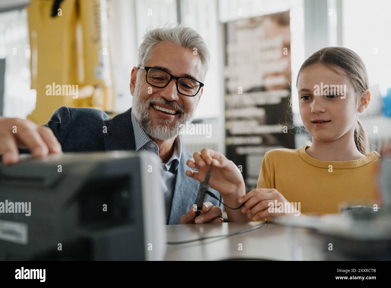 Father and girl during kid at work day, encouraging girl in career in ... Father and girl during kid at work day, encouraging girl in career in ...