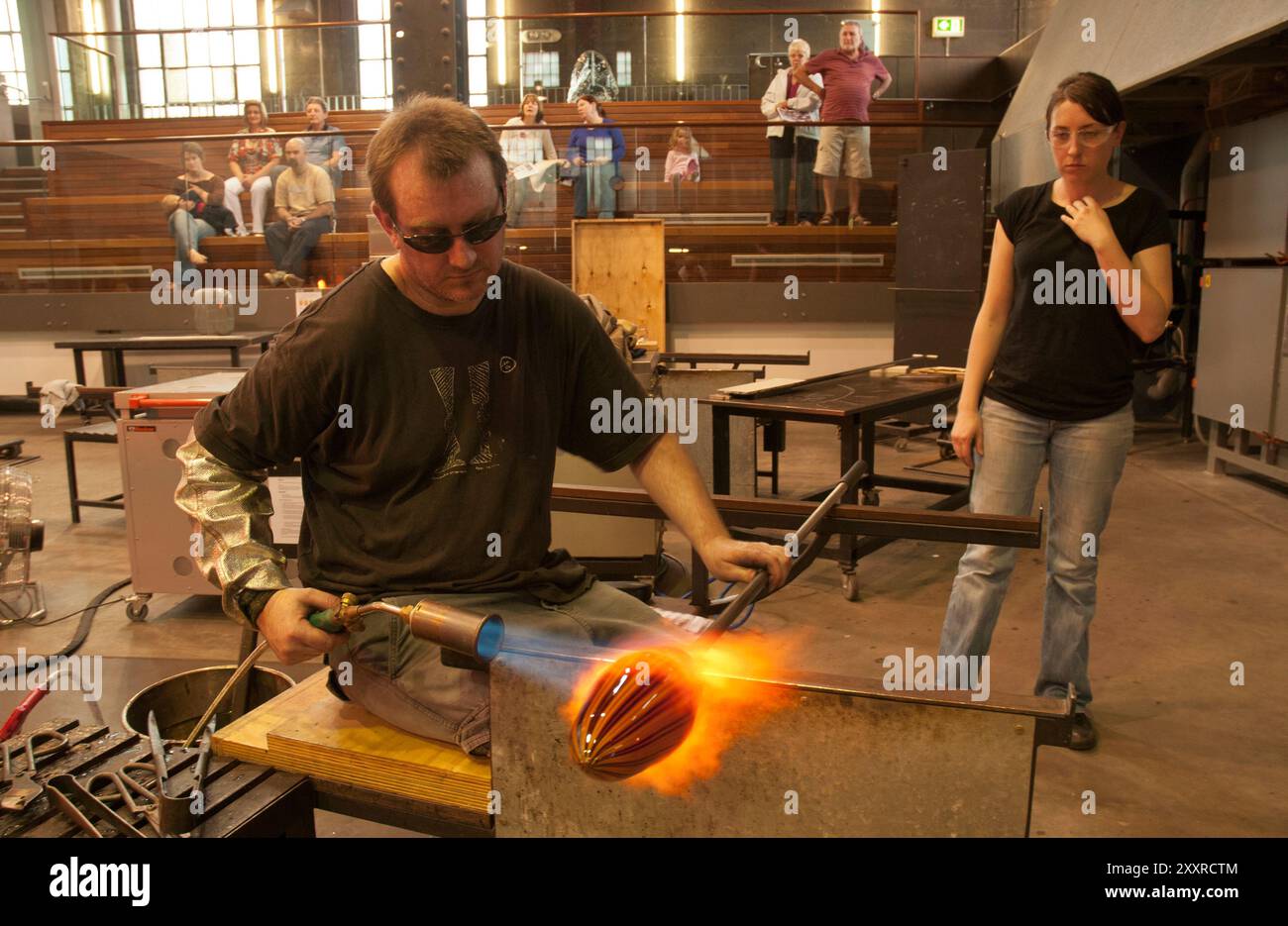 Visitors in the public observation gallery watching glass artists at ...